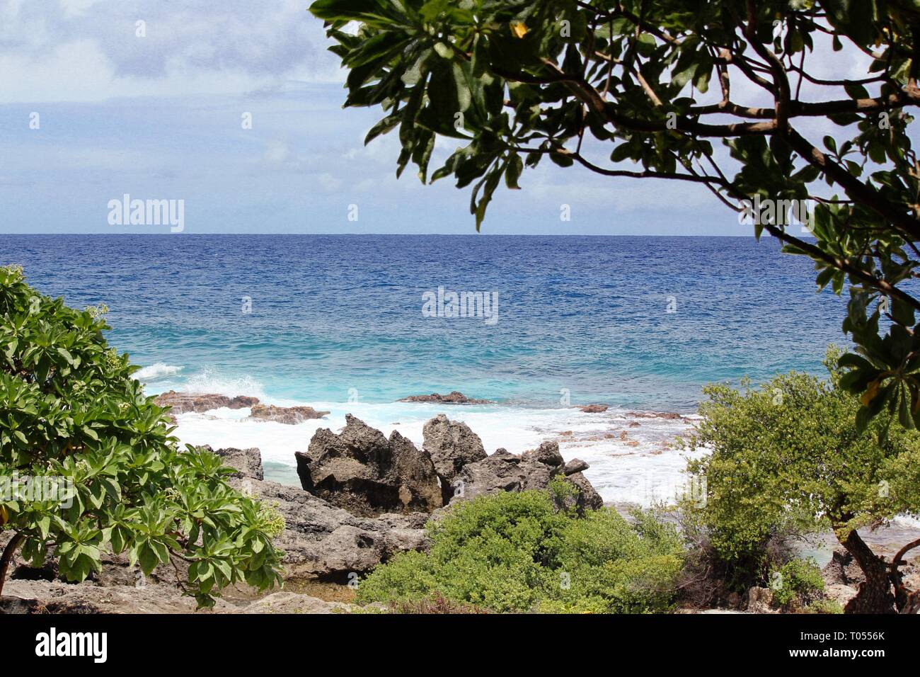 Coastal view of the blue waters and rocky shorelines of Chulu Beach ...