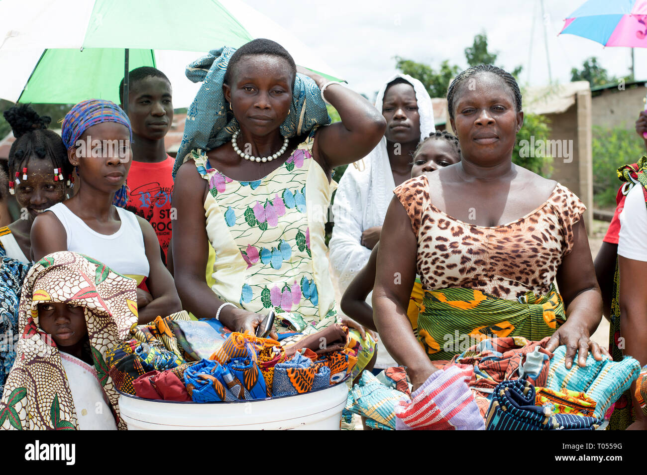 adzopé, ivory coast - August 31, 2016: group of people standing behind ...