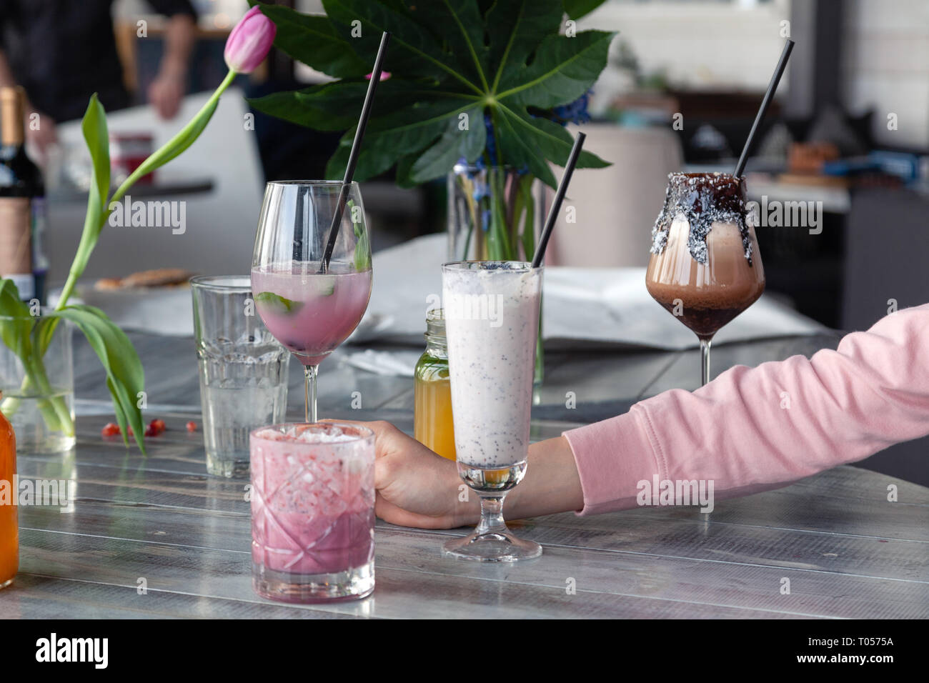 Food stylist and photographer decorate, preparing to shoot various ...