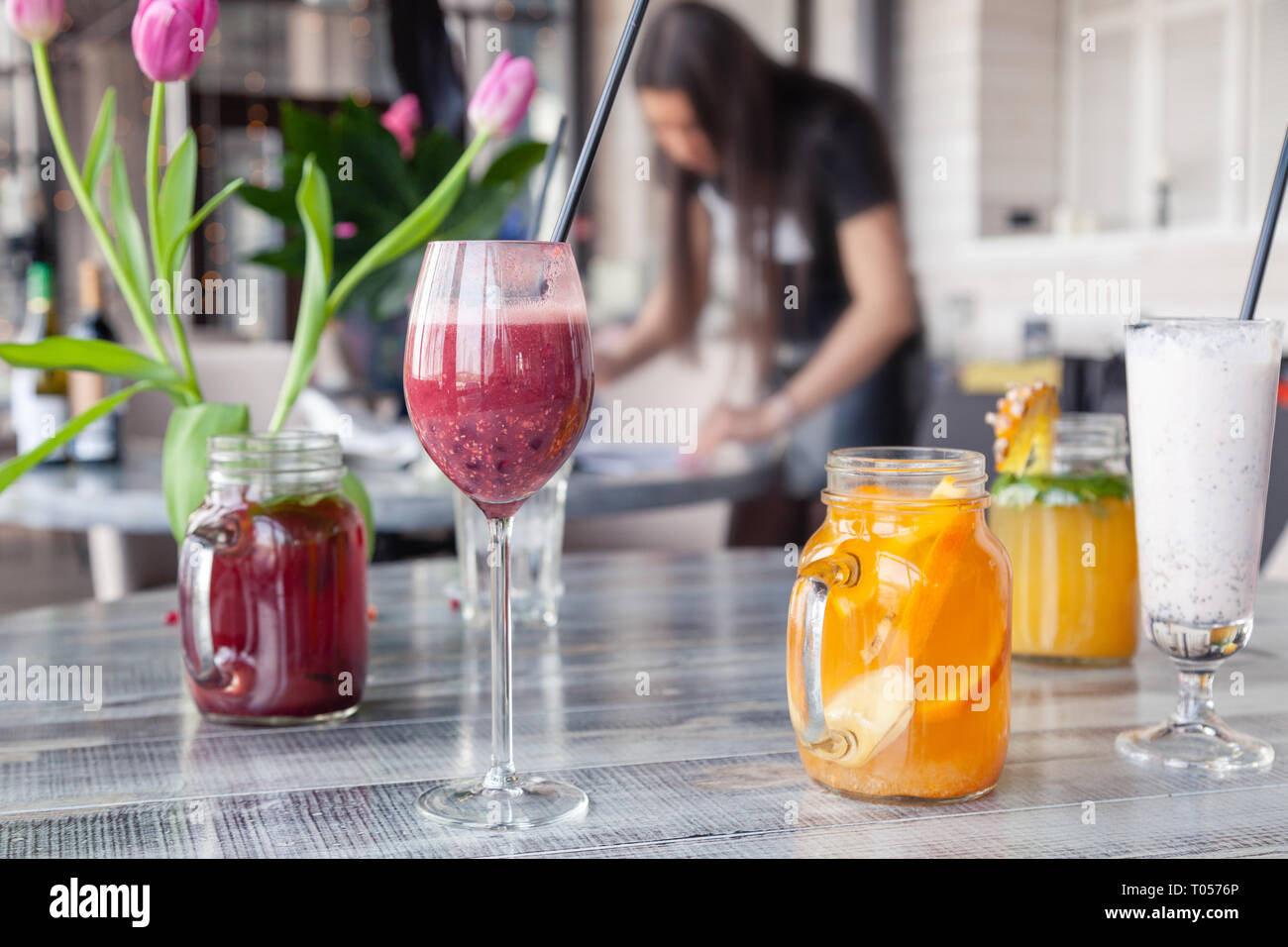 Food stylist and photographer decorate, preparing to shoot various ...