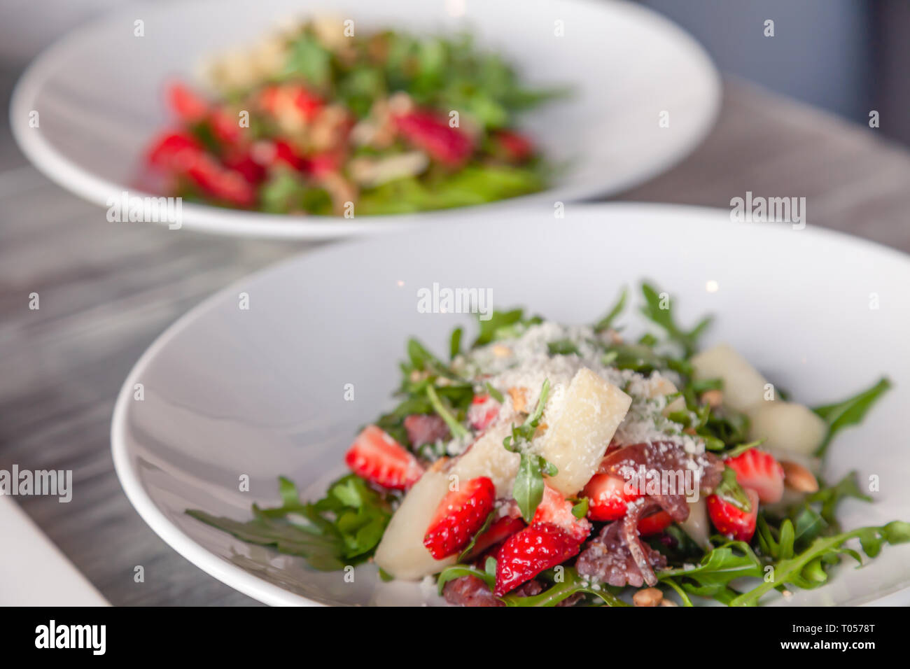 Closeup fresh summer salad with basturma jerky, greens, arugula ...