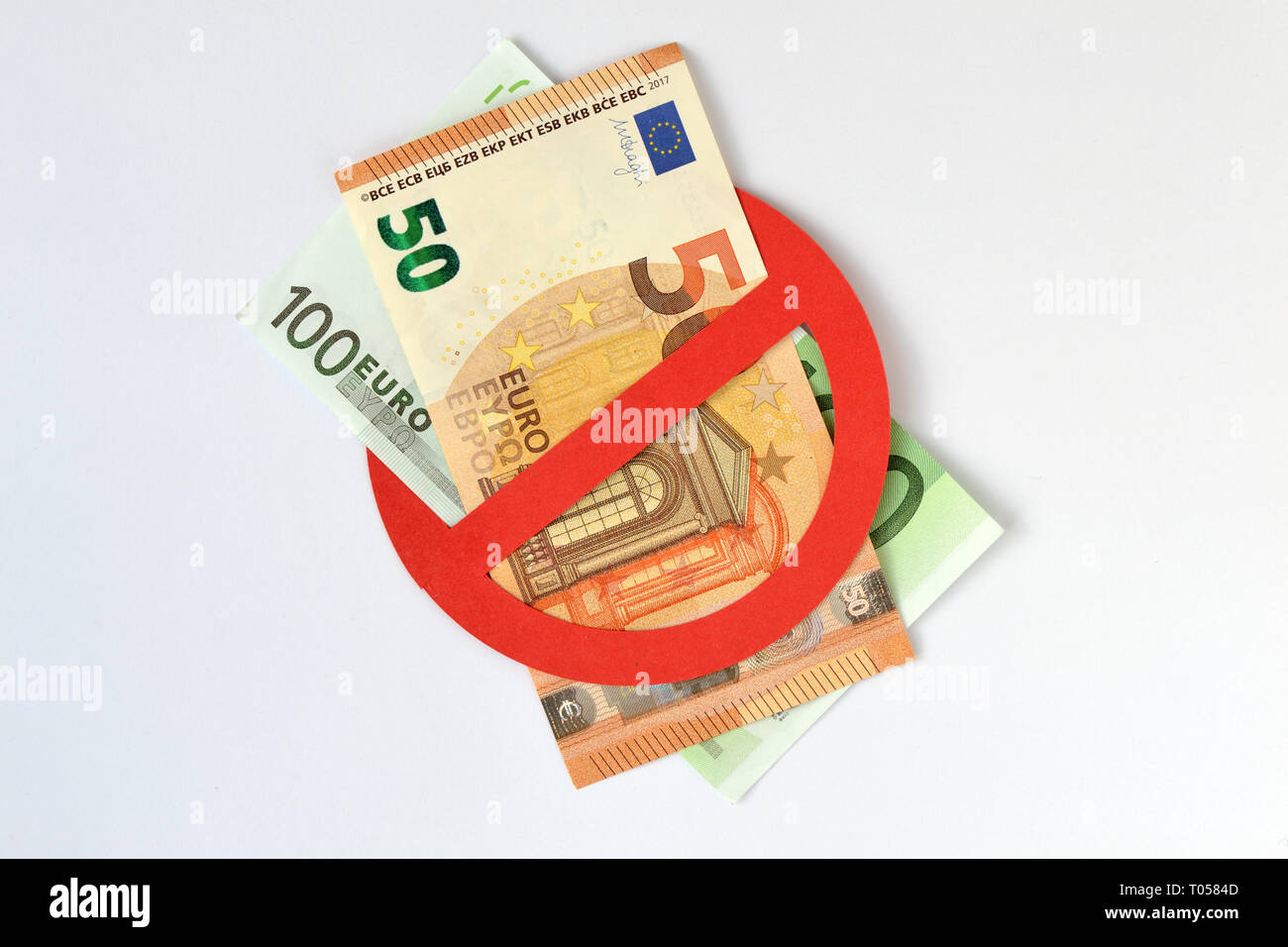 Euro banknotes in prohibition sign on white background - No money ...