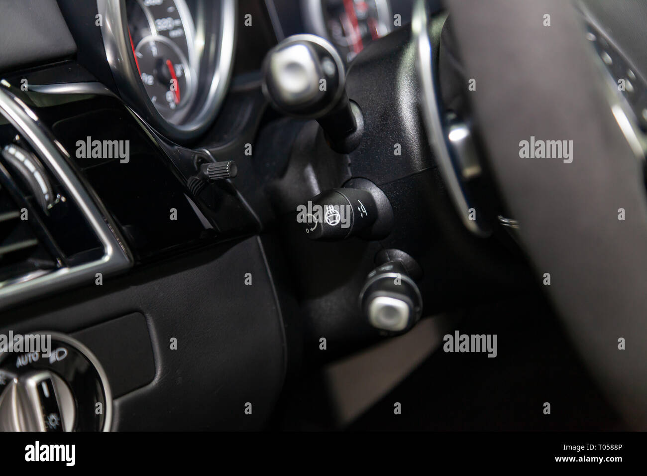 Close-up on a part of the interior of a modern luxury car with a view ...