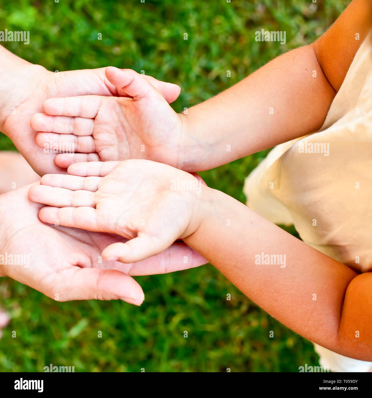 Top view of little girl showing her clean hands with palms up to mother ...