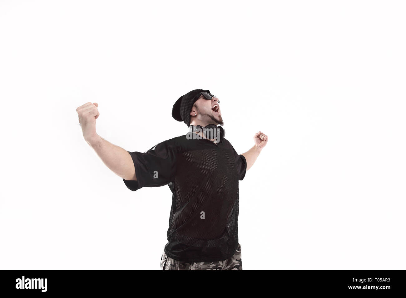 very happy cool rapper in a black hat.isolated on white Stock Photo - Alamy