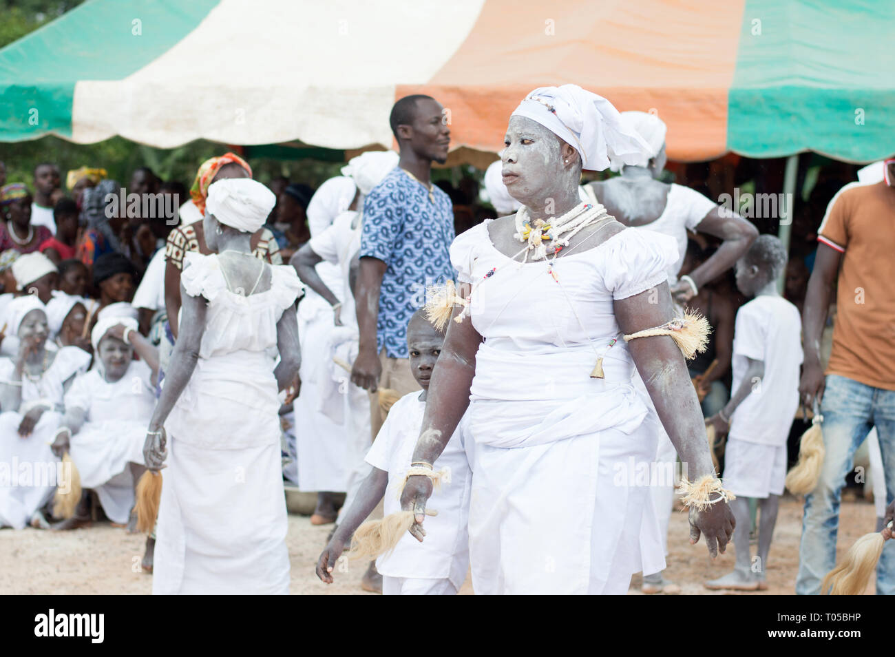 adzopé, ivory coast-August 31, 2016: a young lady dressed in white with ...