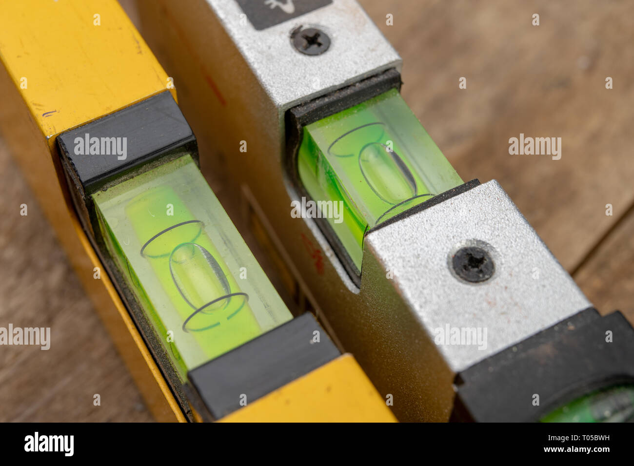 Measuring the slope of a surface using a spirit level. Measuring ...