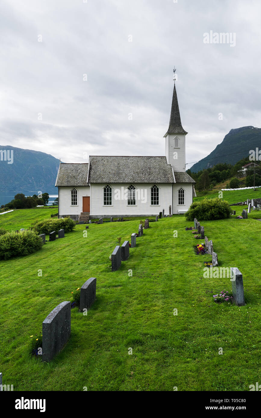 Nes kyrkje, Commune Luster, Norway. White wooden church and churchyard ...