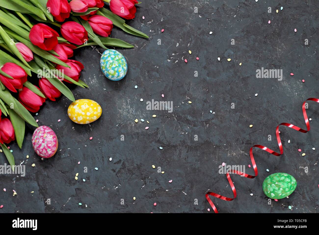 Easter background. Tulips with coffee, colorful eggs and croissant. Top ...
