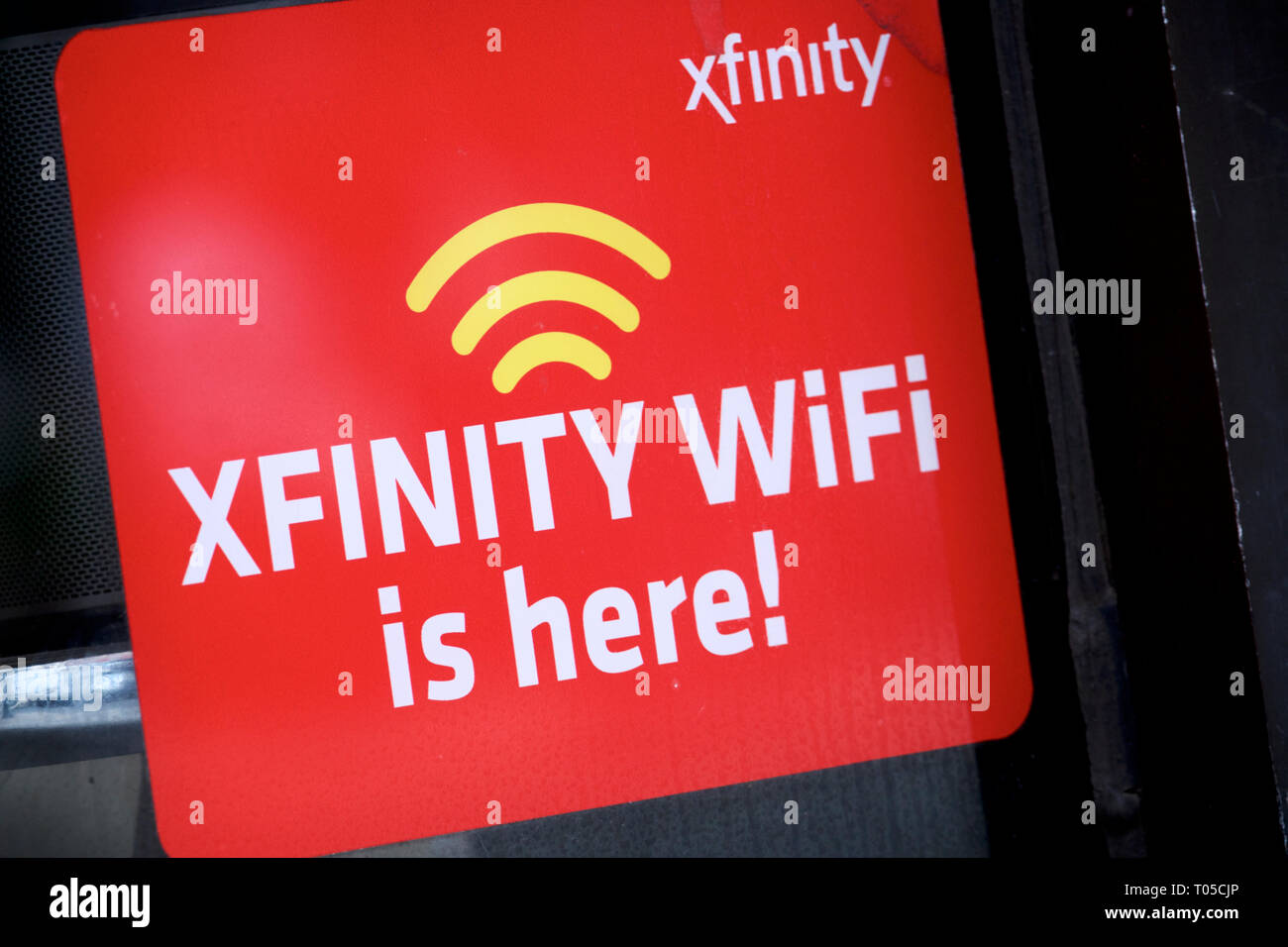 Comcast advertisement for its Xfinity wireless internet in the window ...