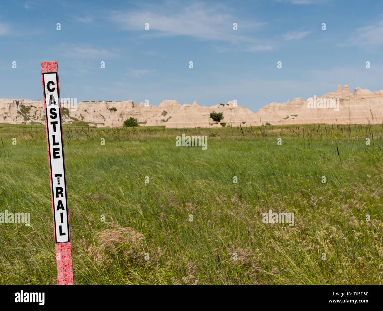Castle Trail Sign in front of field and Badlands hoodoo formation Stock ...