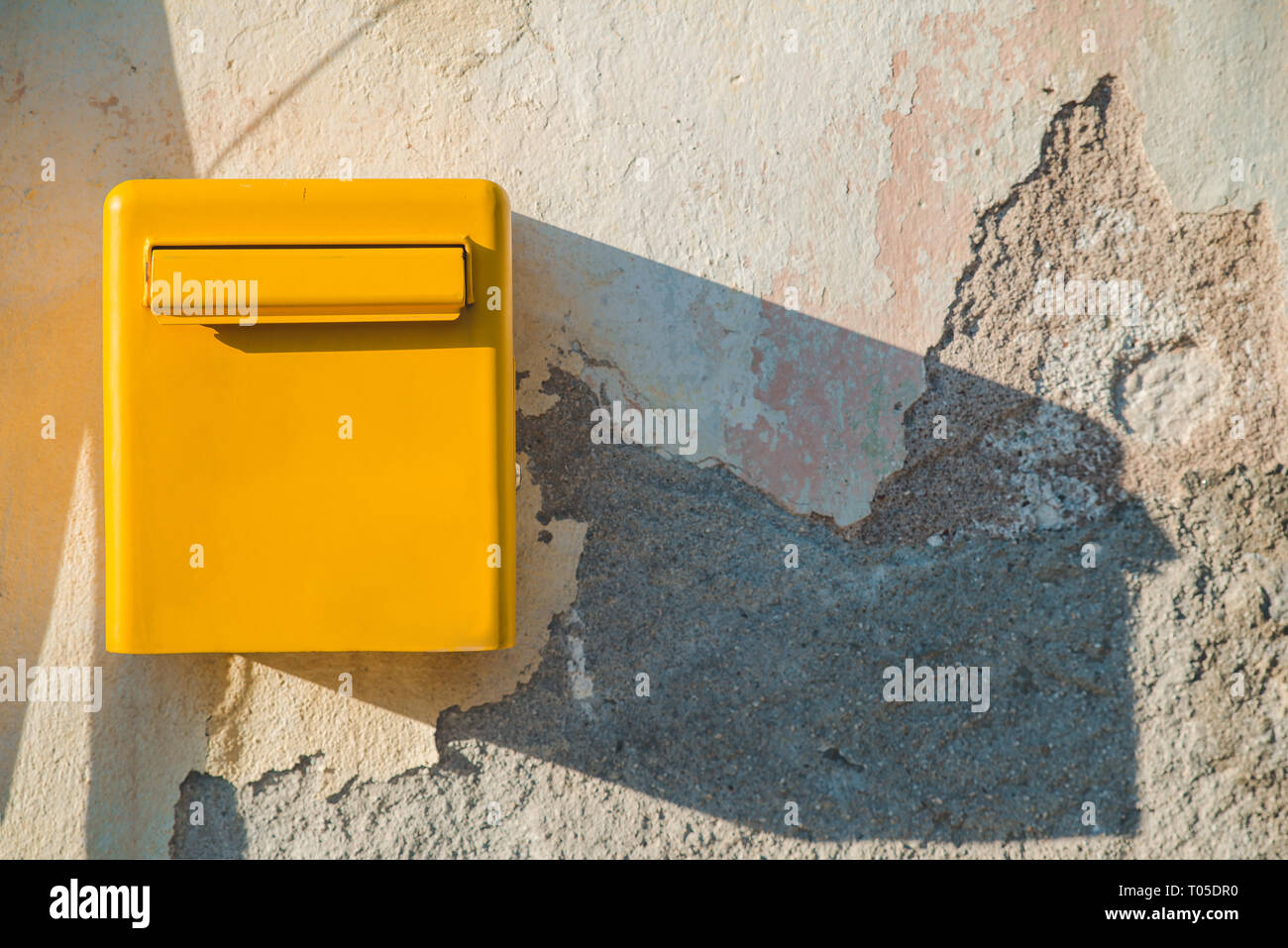 yellow post box on old wall. copy space. letter delivery Stock Photo ...
