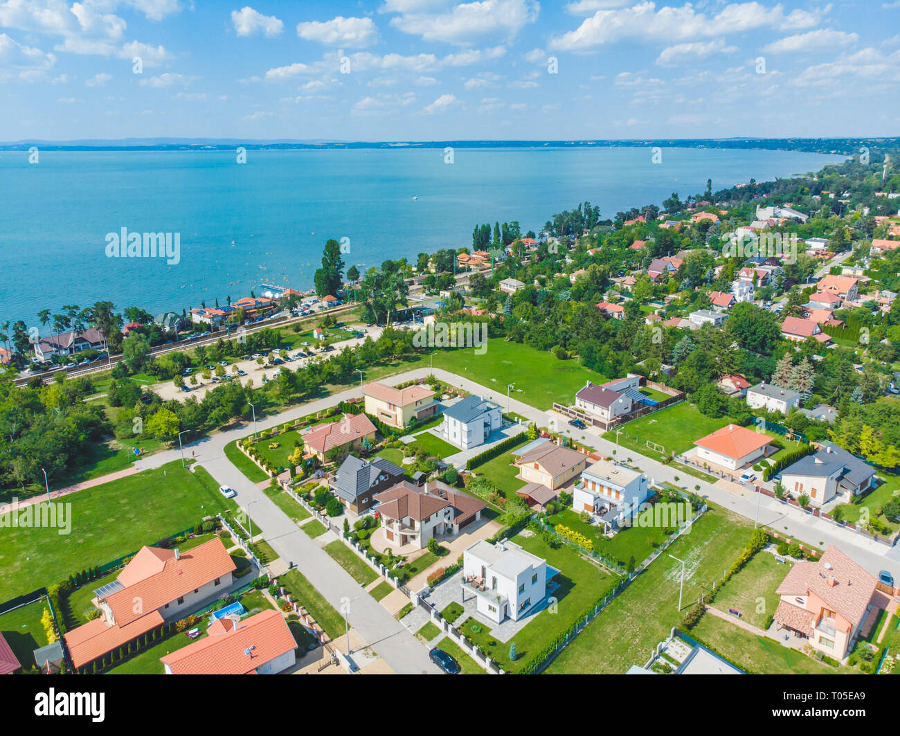 aerial view of village near big lake. summer time Stock Photo - Alamy