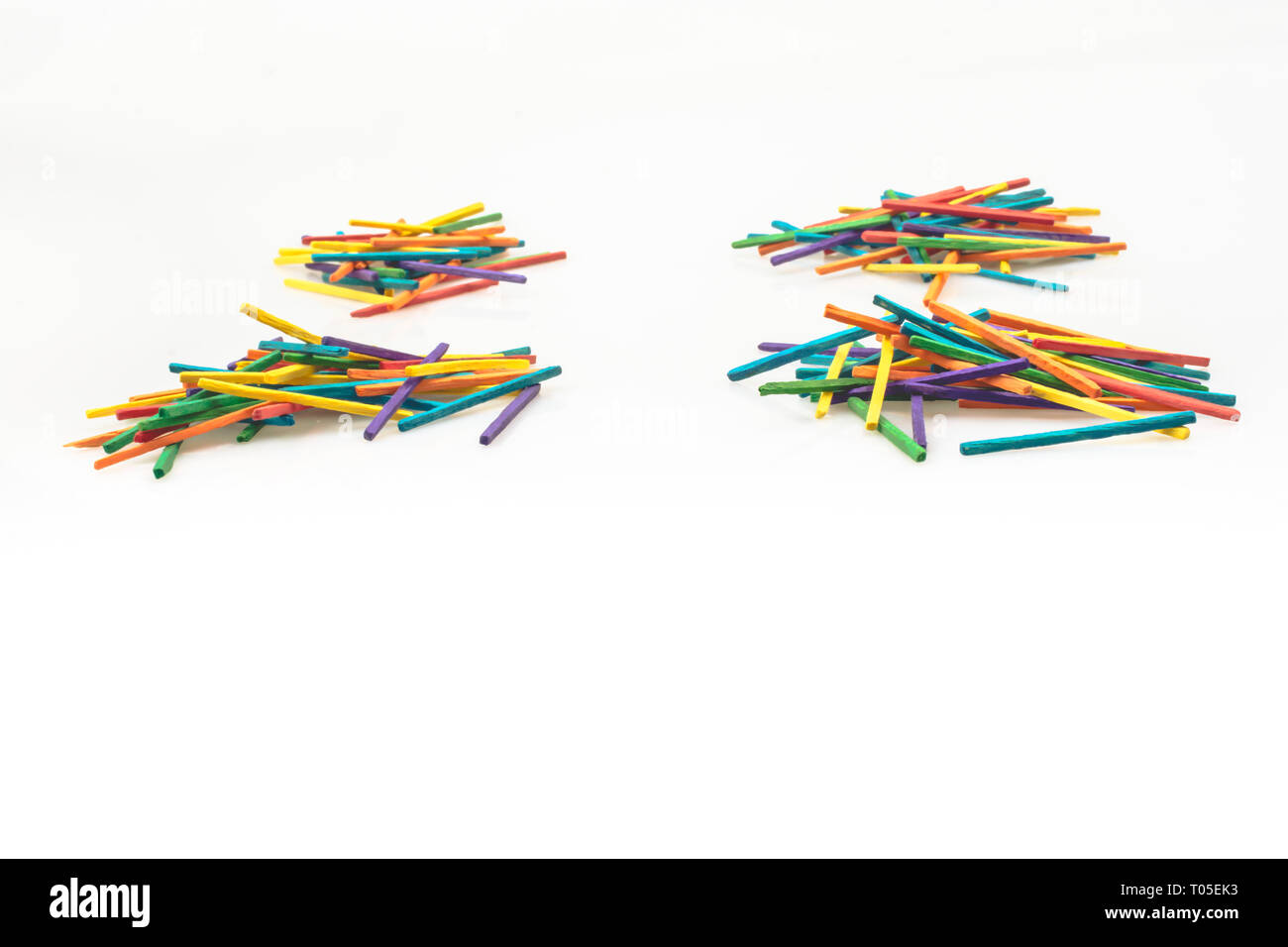 Beautiful coloured wooden sticks for creativity on black background ...