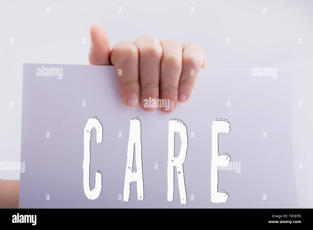 Hand holding care word on a white background Stock Photo - Alamy