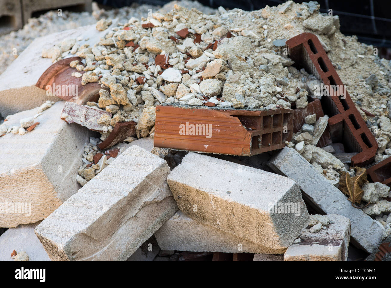 Background of building rubble with terracotta bricks and other white ...