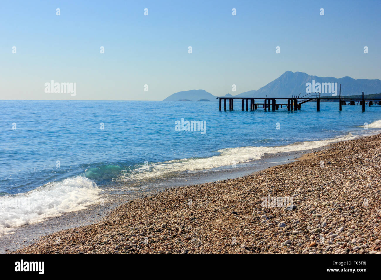 Mediterranean landscape in Antalya, Turkey. Blue sea, pier and far ...