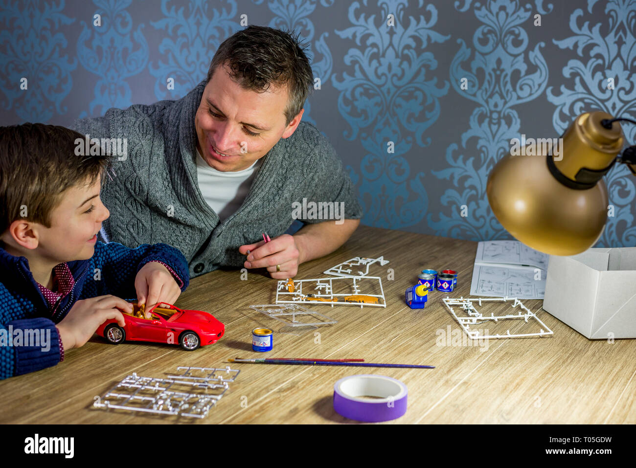 Father and son making a car kit hi-res stock photography and images - Alamy