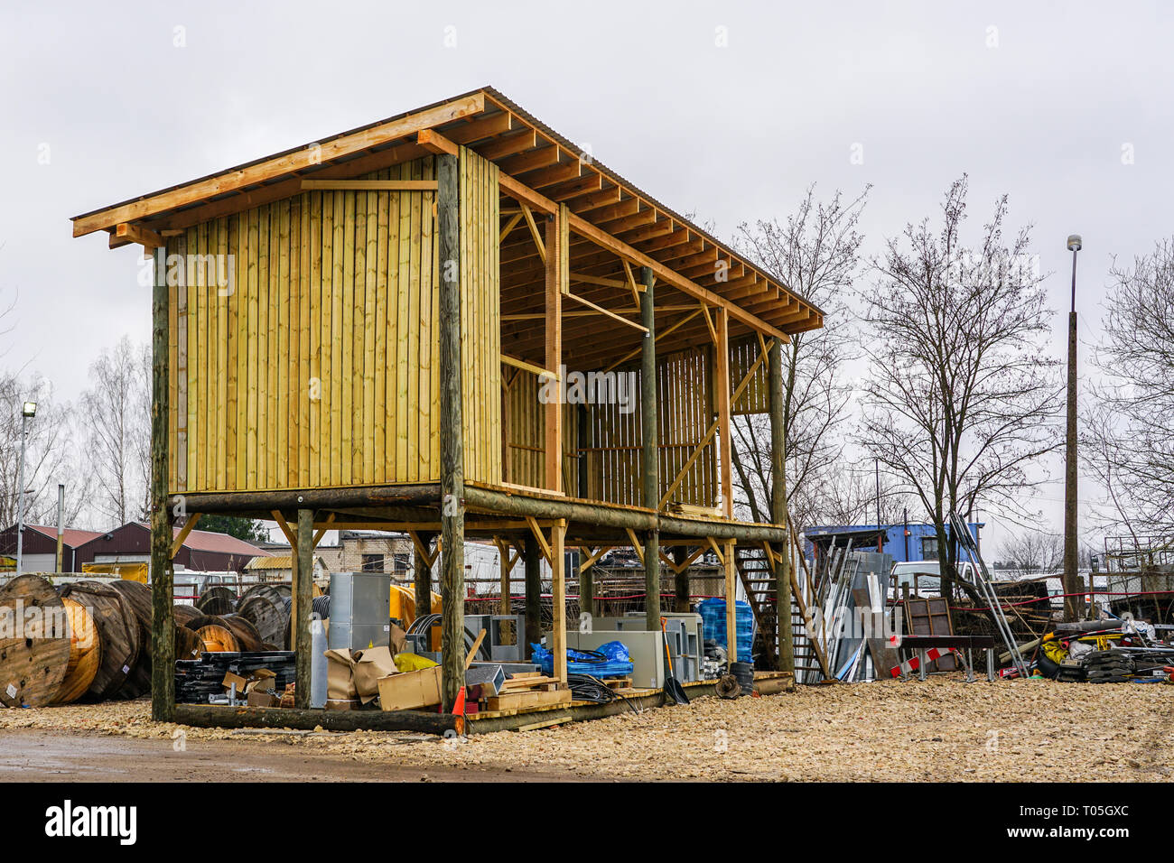 new small wooden warehouse on a high base in the construction process ...