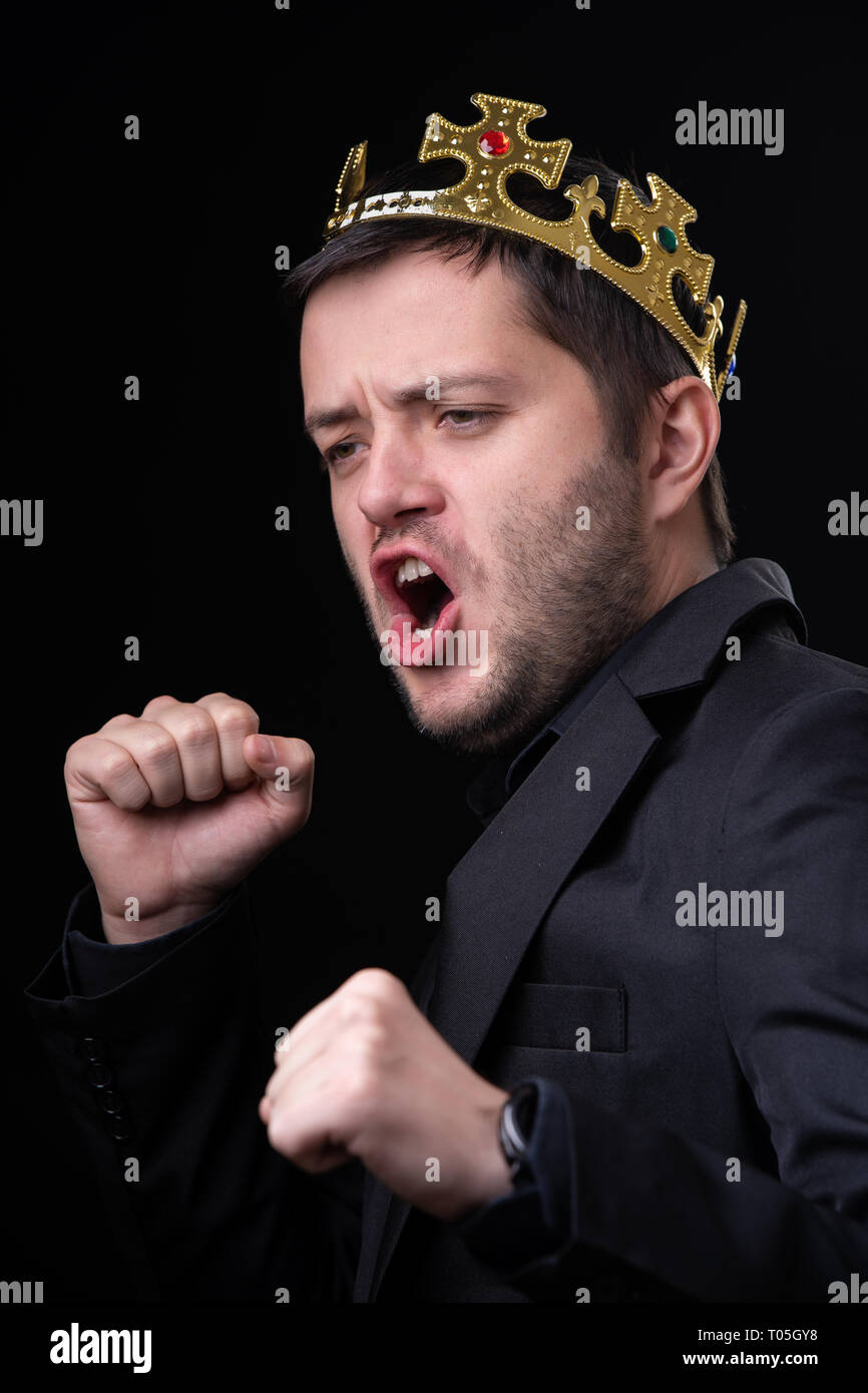 Man in crown and business suit Stock Photo - Alamy