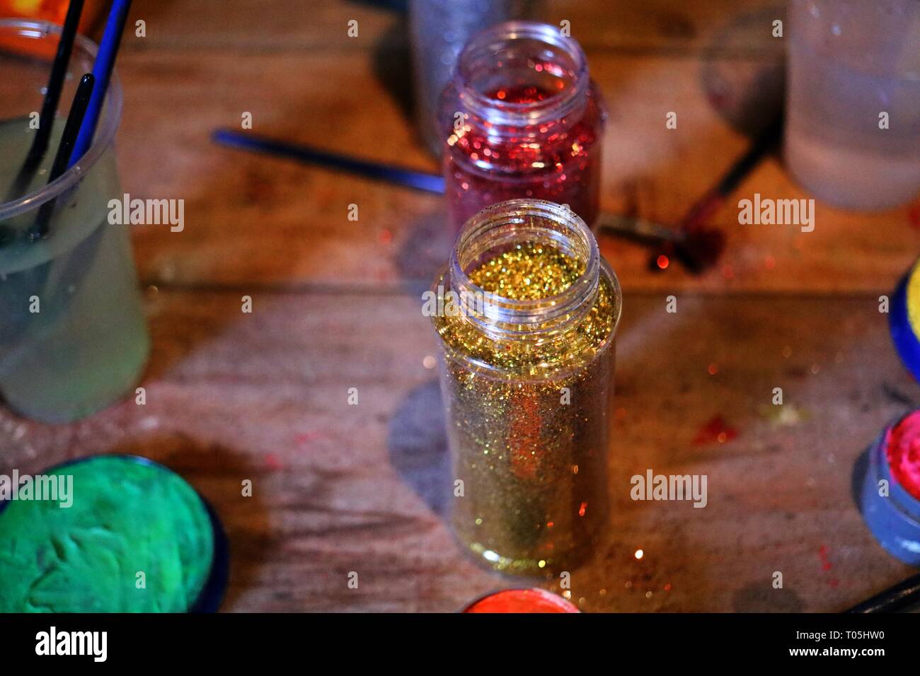 Table with multi colored paints Stock Photo - Alamy