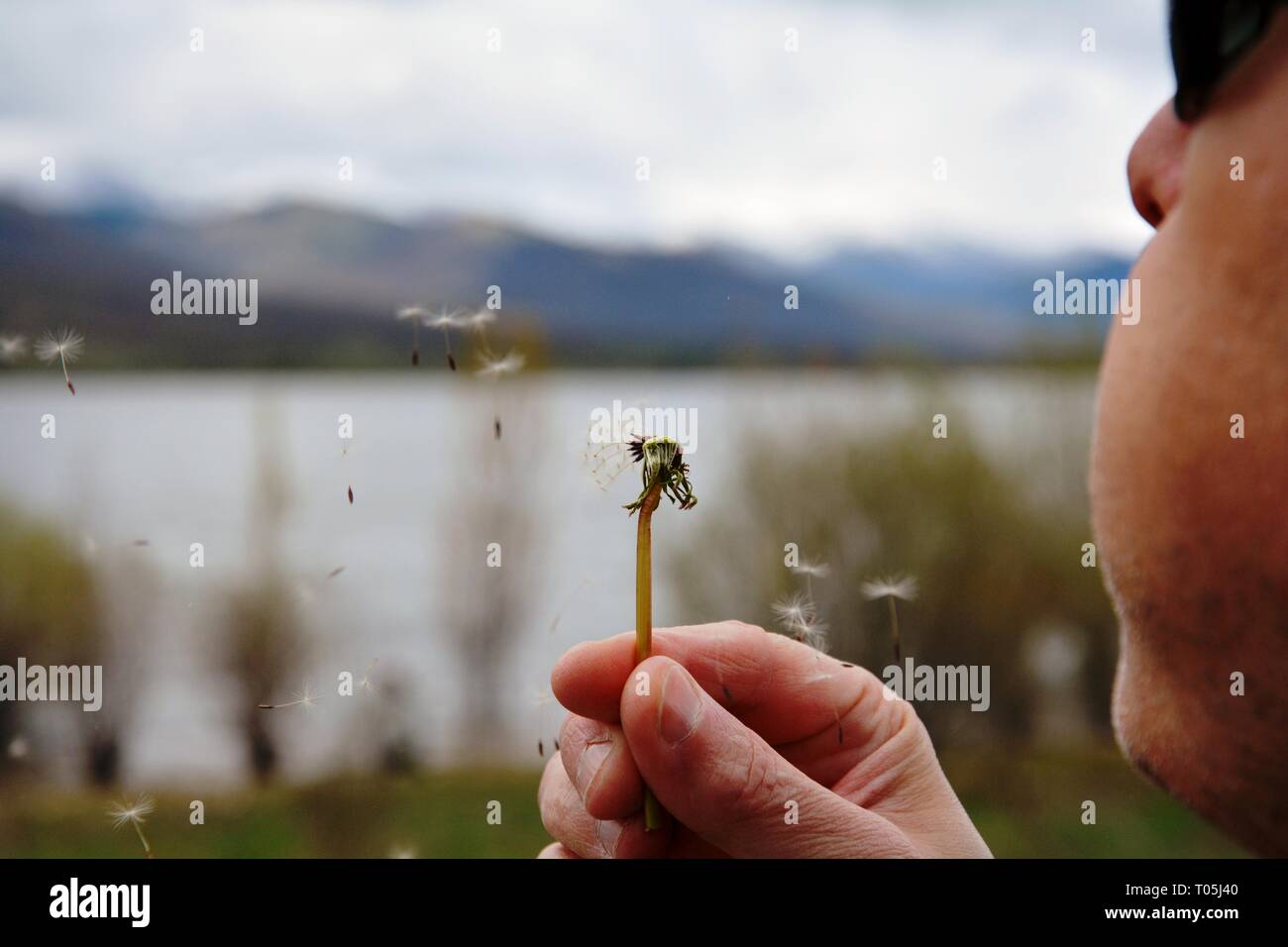 Blowing hand hi-res stock photography and images - Alamy