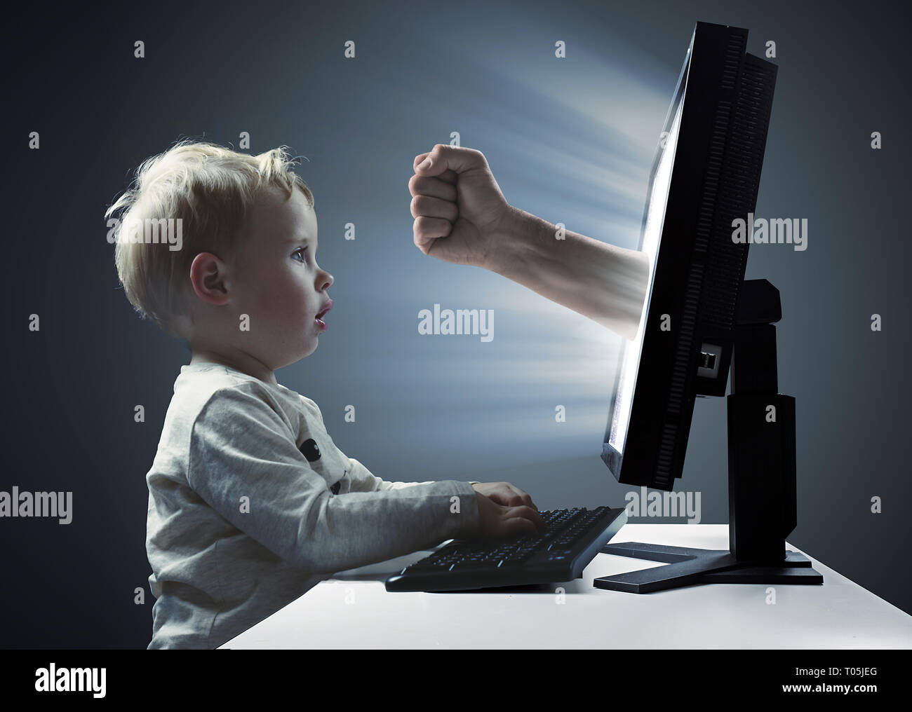 Cute, little boy looking at the display monitor - Internet violence ...