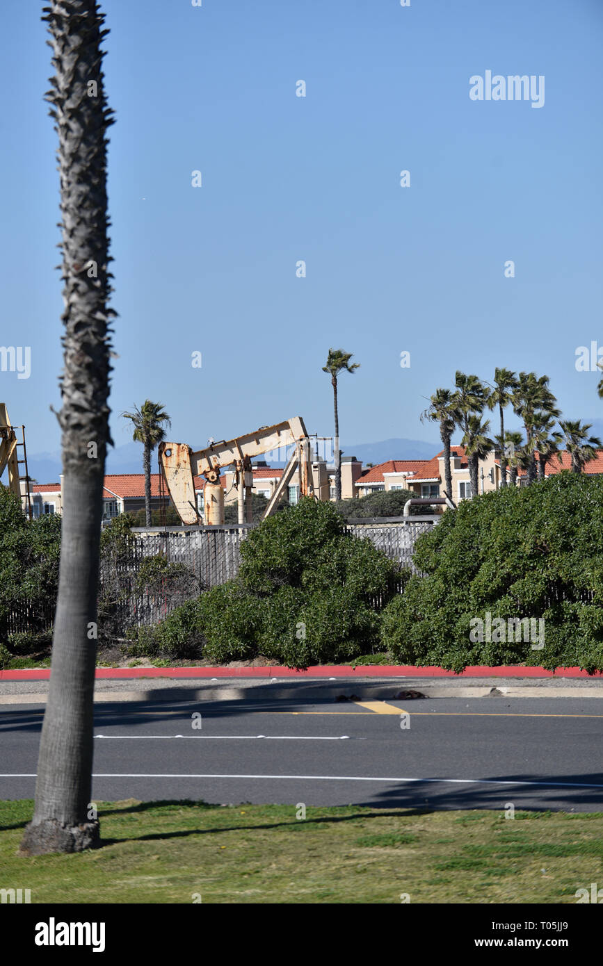 An oil pump jack working in a residential area in Orange County ...
