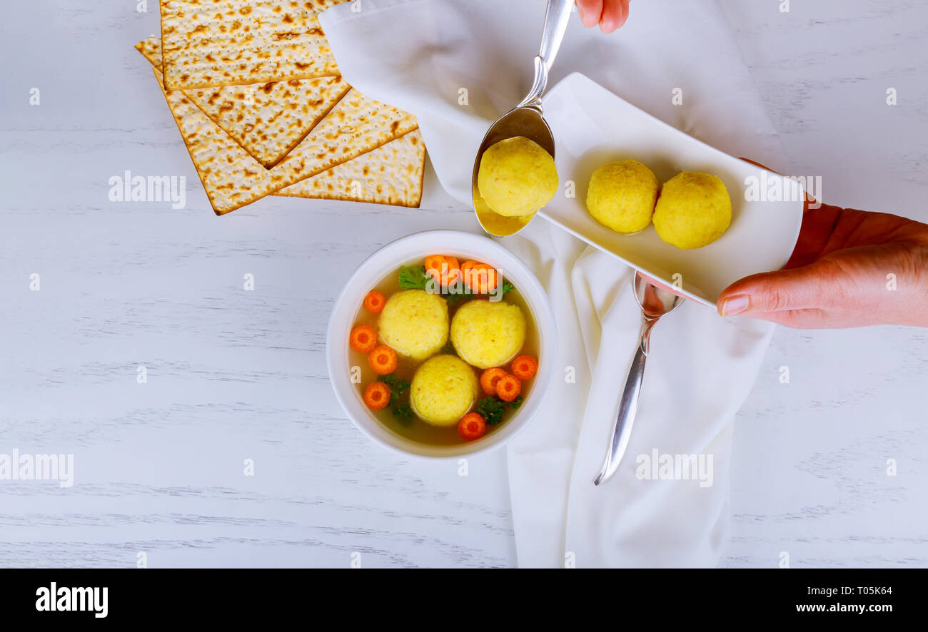 Passover Jewish matzah balls in a pot of soup during the Jewish holiday ...