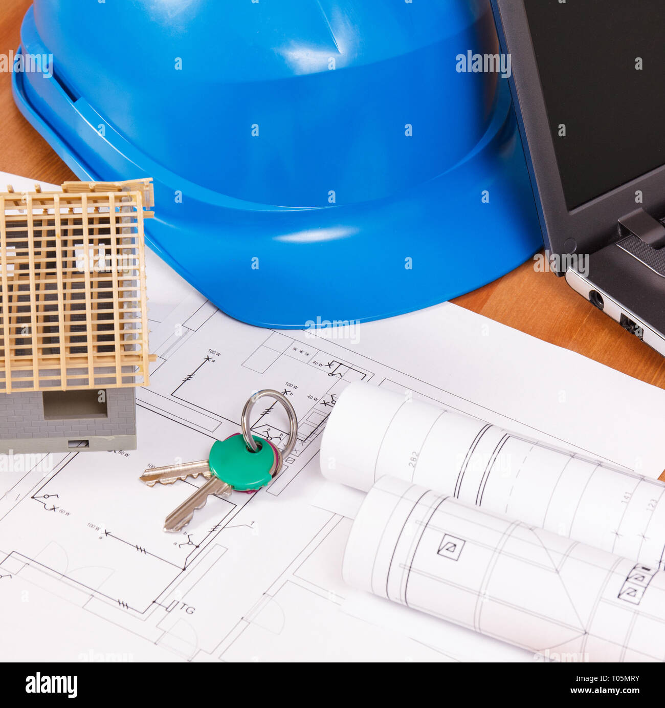 Home keys, small house under construction, electrical diagrams with ...