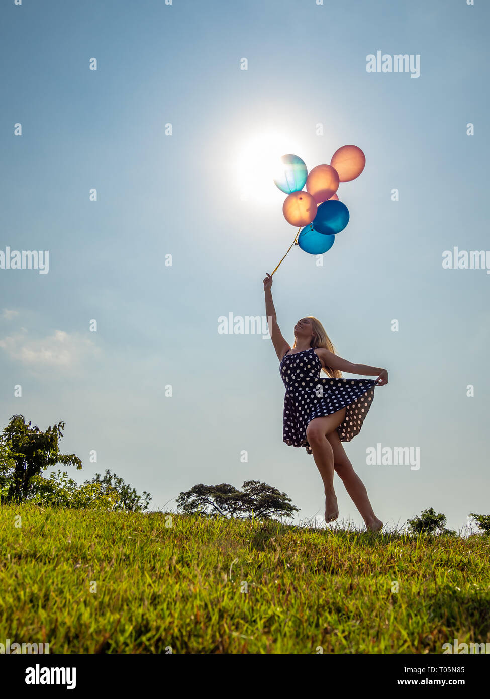 Female ballet dancer holding balloons Stock Photo - Alamy