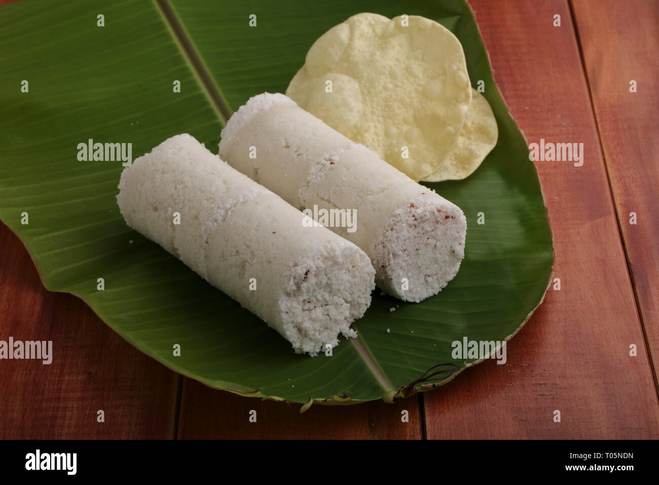 Kerala white rice puttu on banana leaf Stock Photo - Alamy