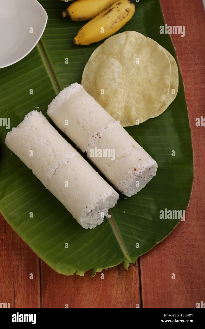 Kerala white rice puttu on banana leaf Stock Photo - Alamy