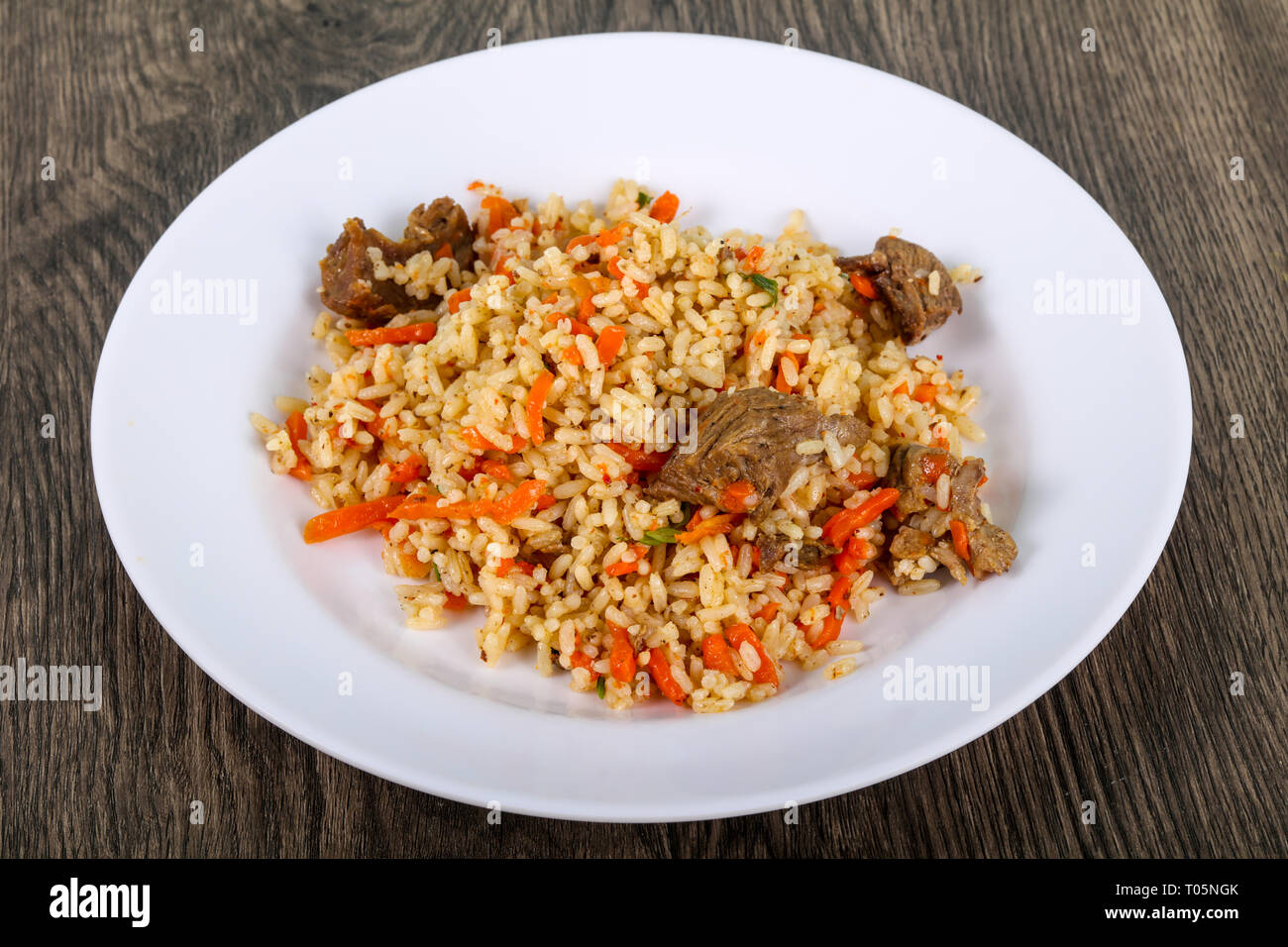 Asian rice - Plov with meat and carrot Stock Photo - Alamy
