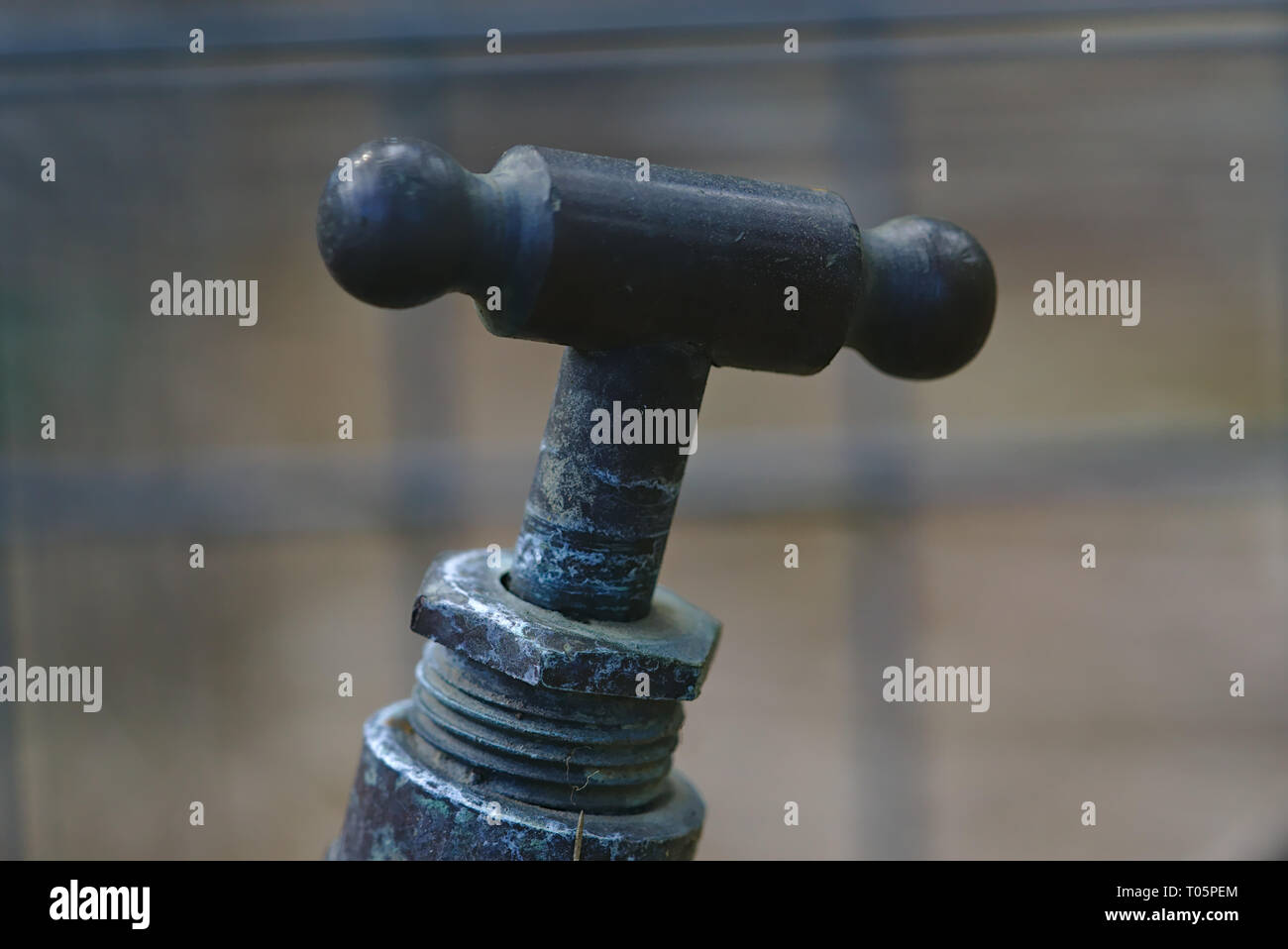 Close up look of top part of old iron tap faucet Stock Photo - Alamy