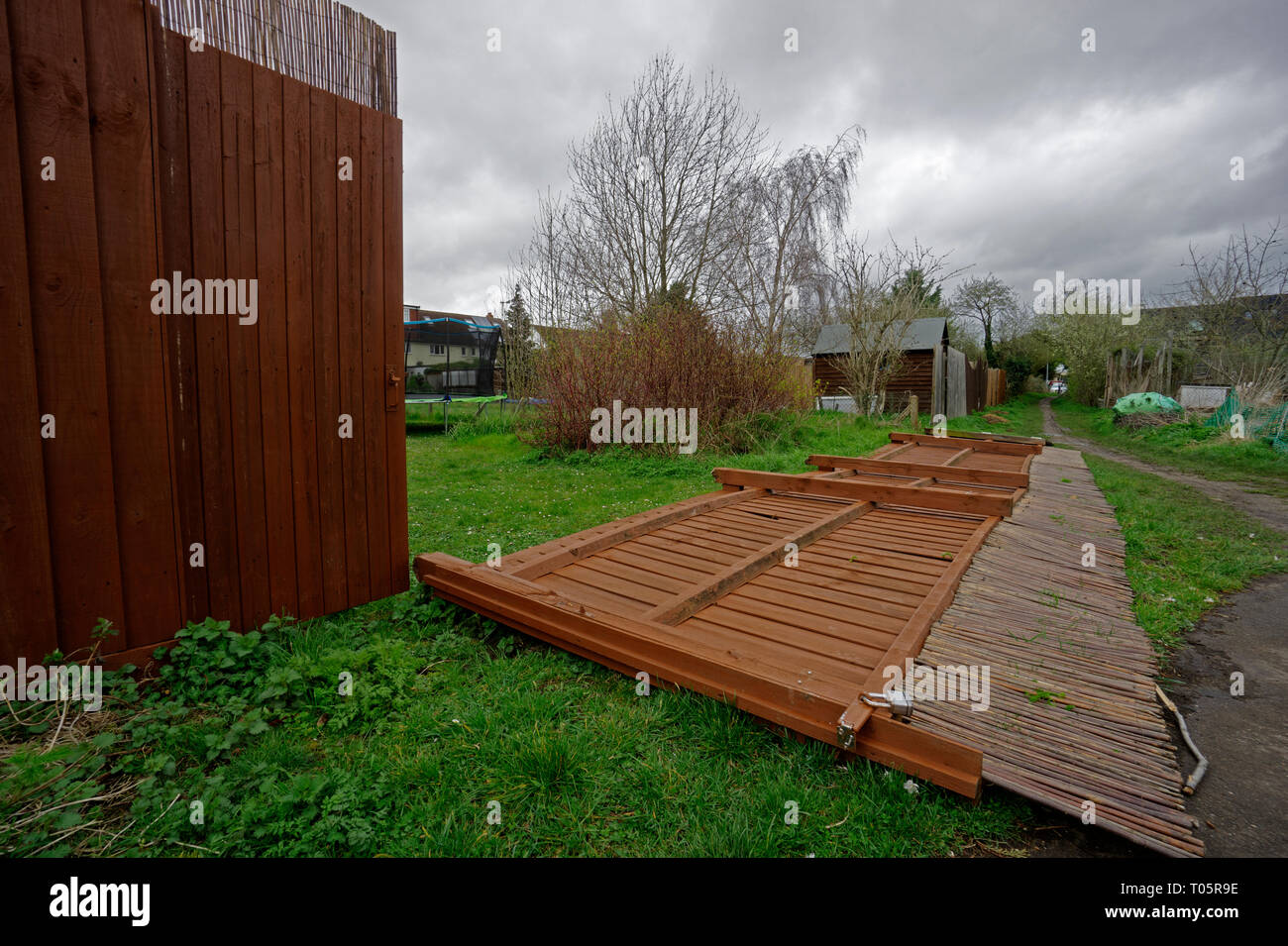 Fence blown over hi-res stock photography and images - Alamy