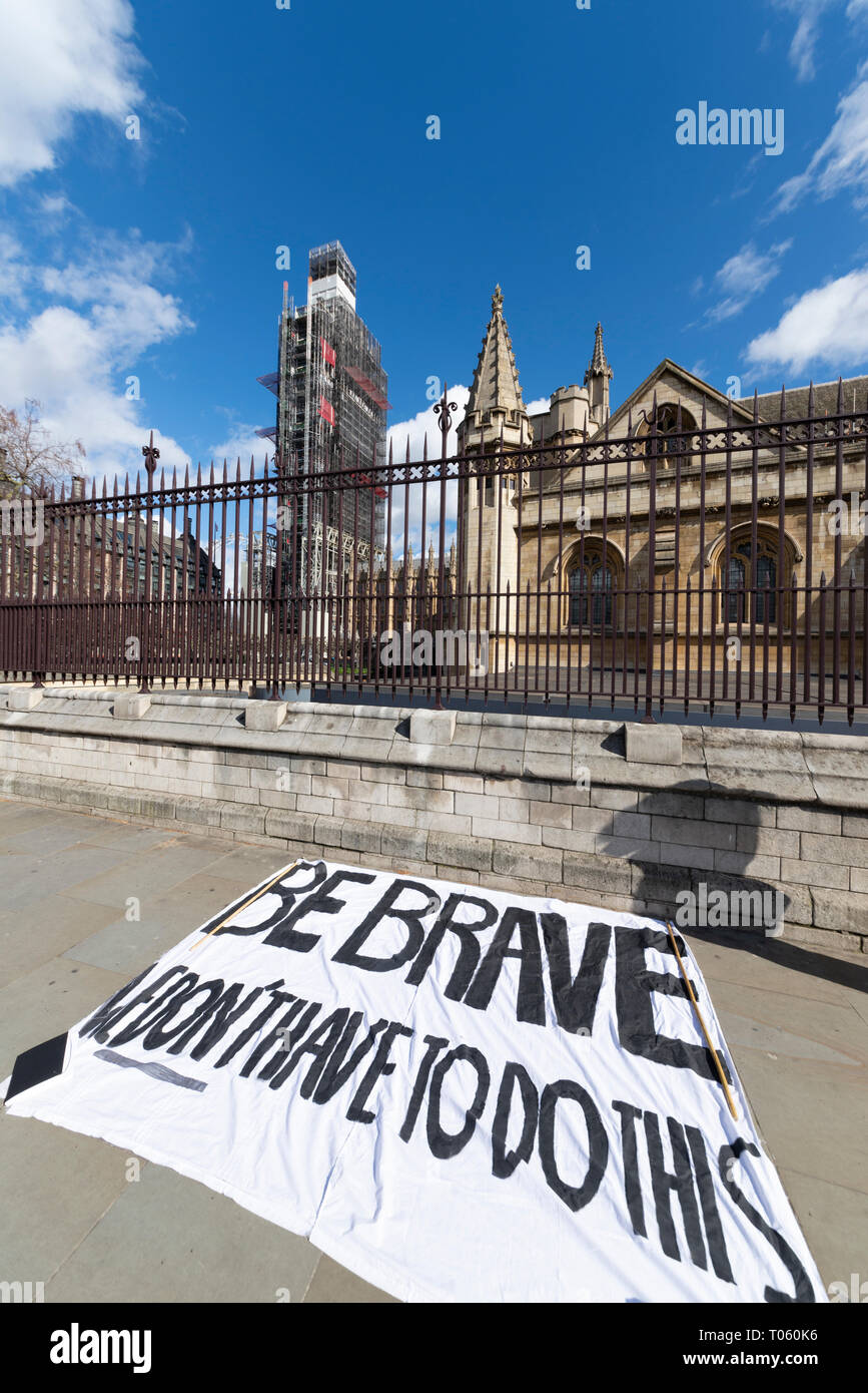Westminster, London, UK. A lone banner outside the Houses of Parliament ...