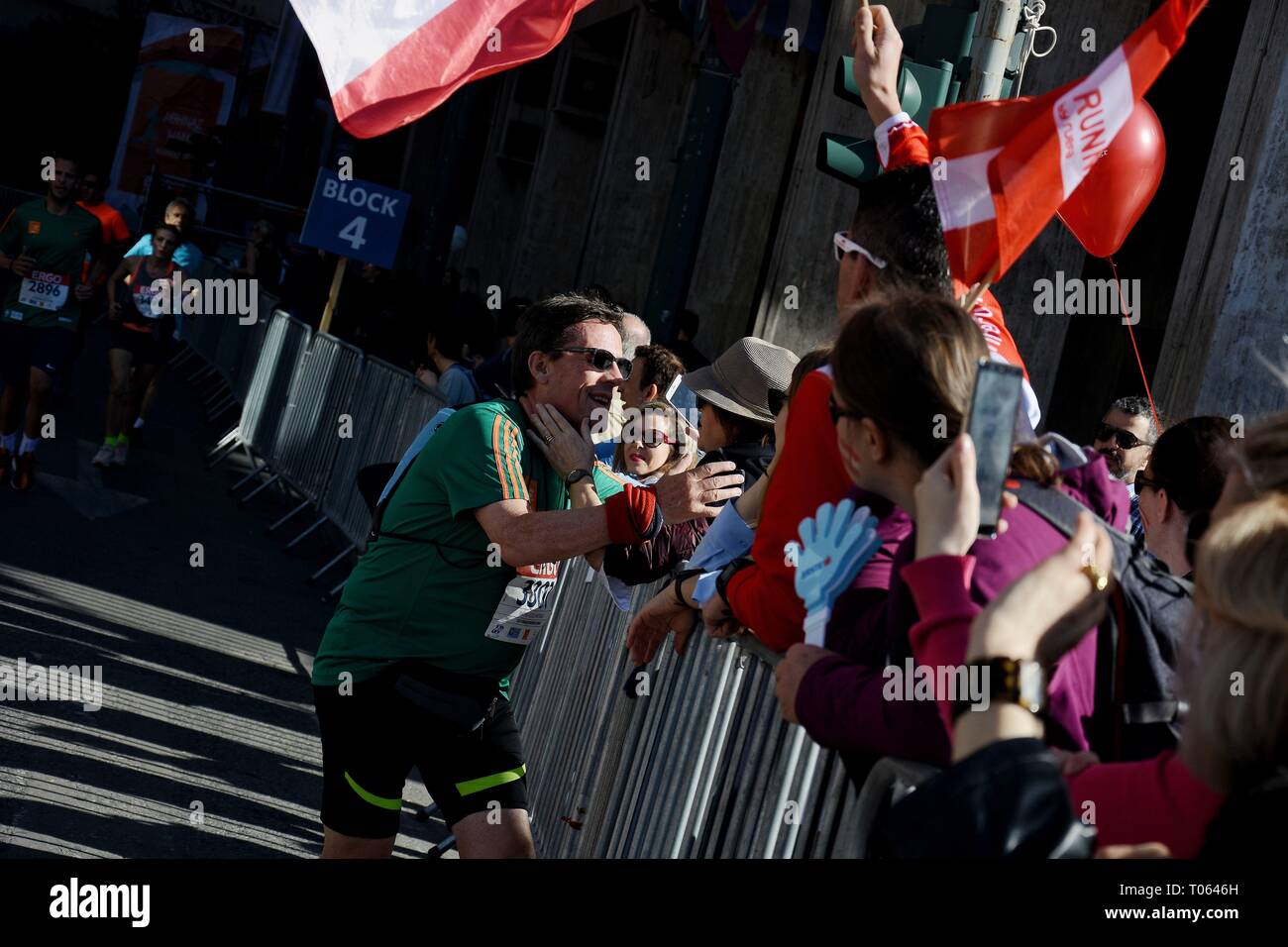 Athens, Greece. 17th Mar, 2019. A runner seen hugging a spectator at ...