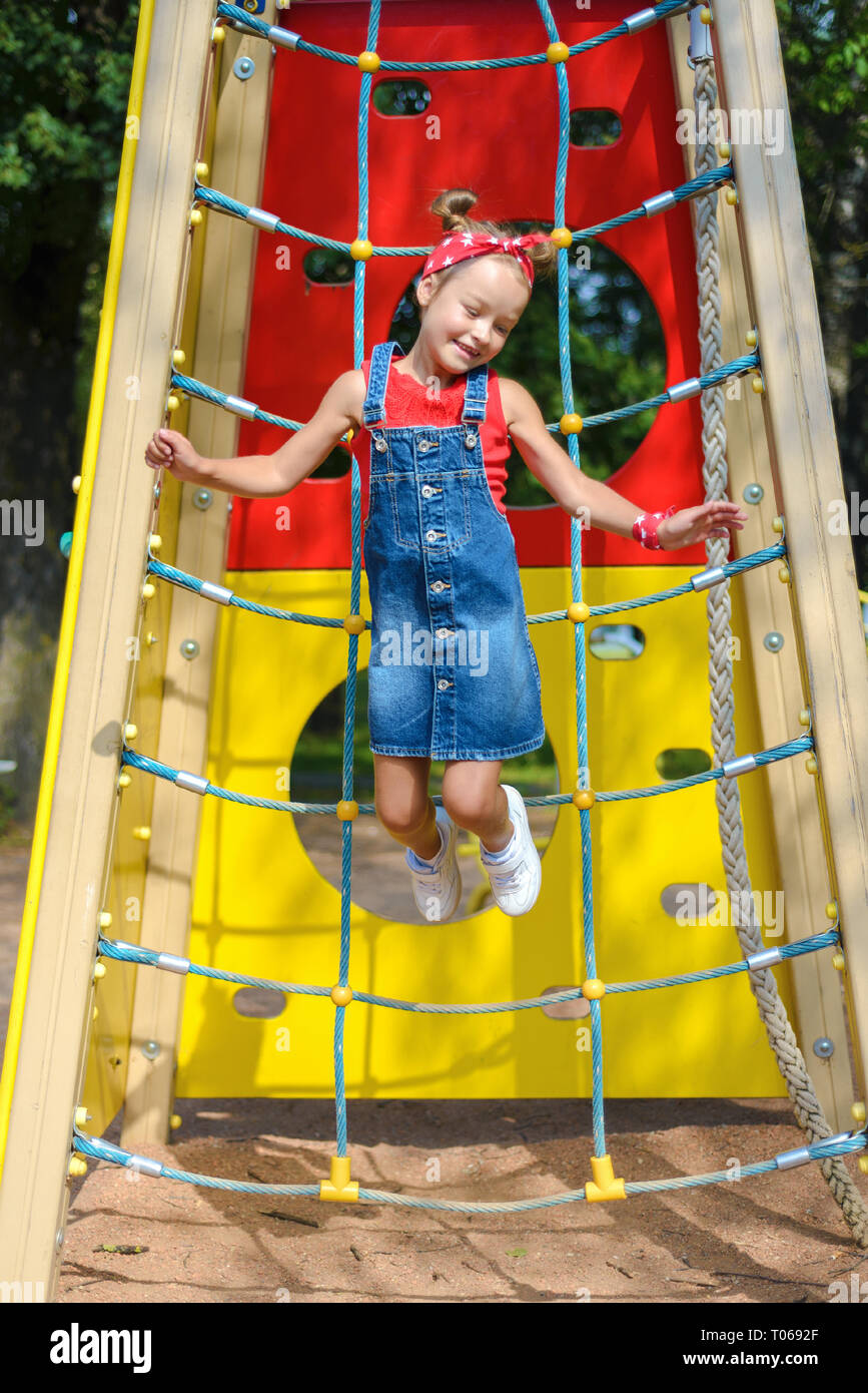 happy child jumping and playing on children's playground Stock Photo ...