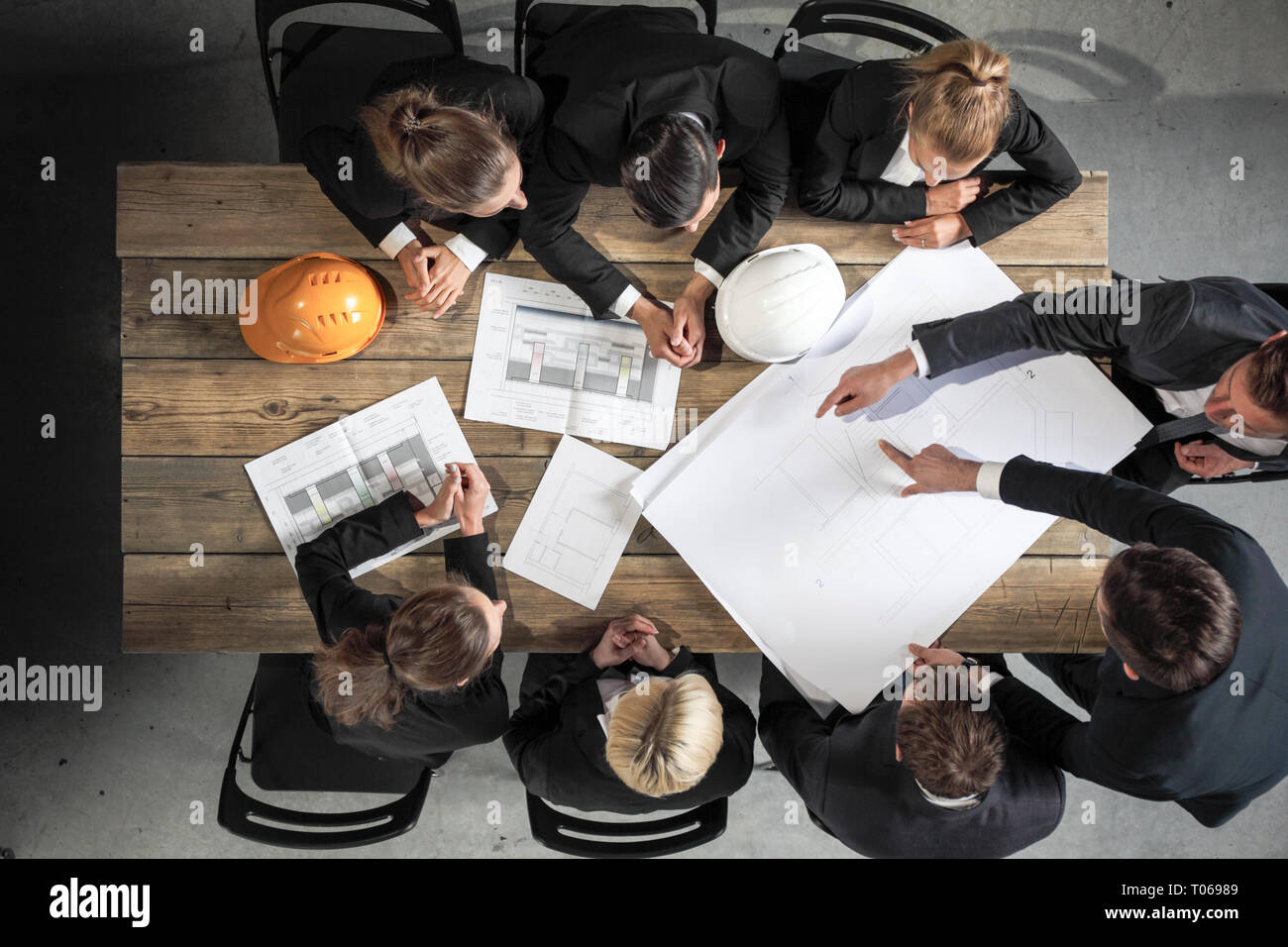 Engineers and businessmen are discussing construction projects in ...