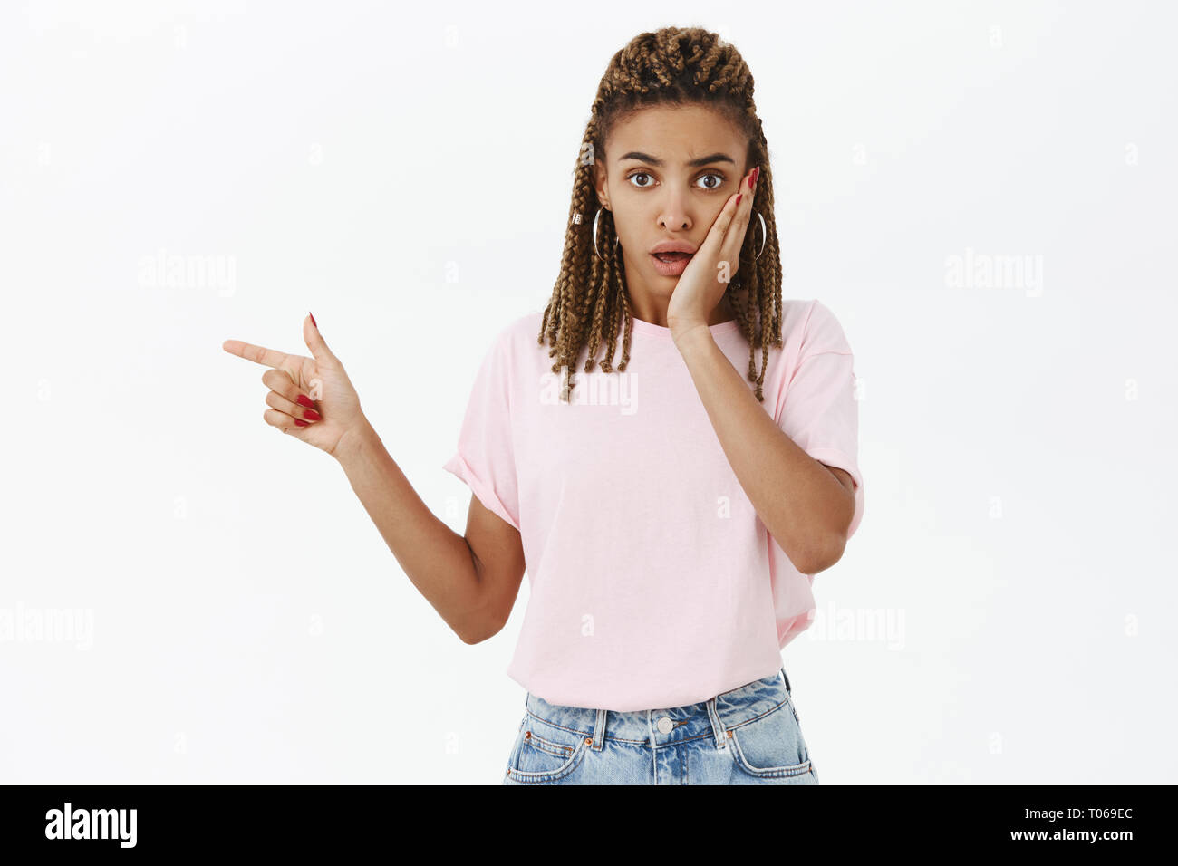 Portrait of shocked and concerned woman learning stunning and terrible ...