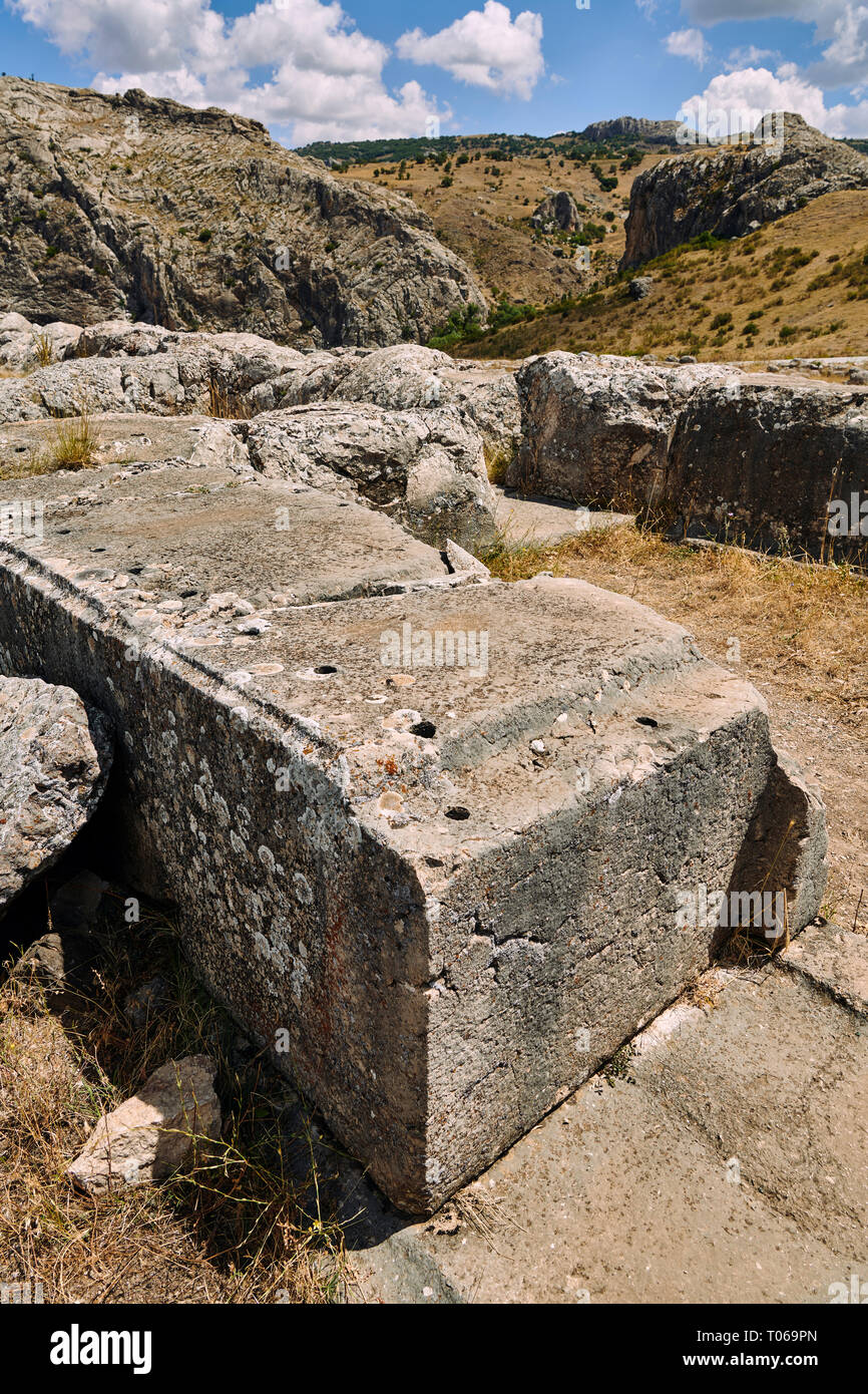 Dressed stone blocks of Temple I walls with round holes that held pins ...