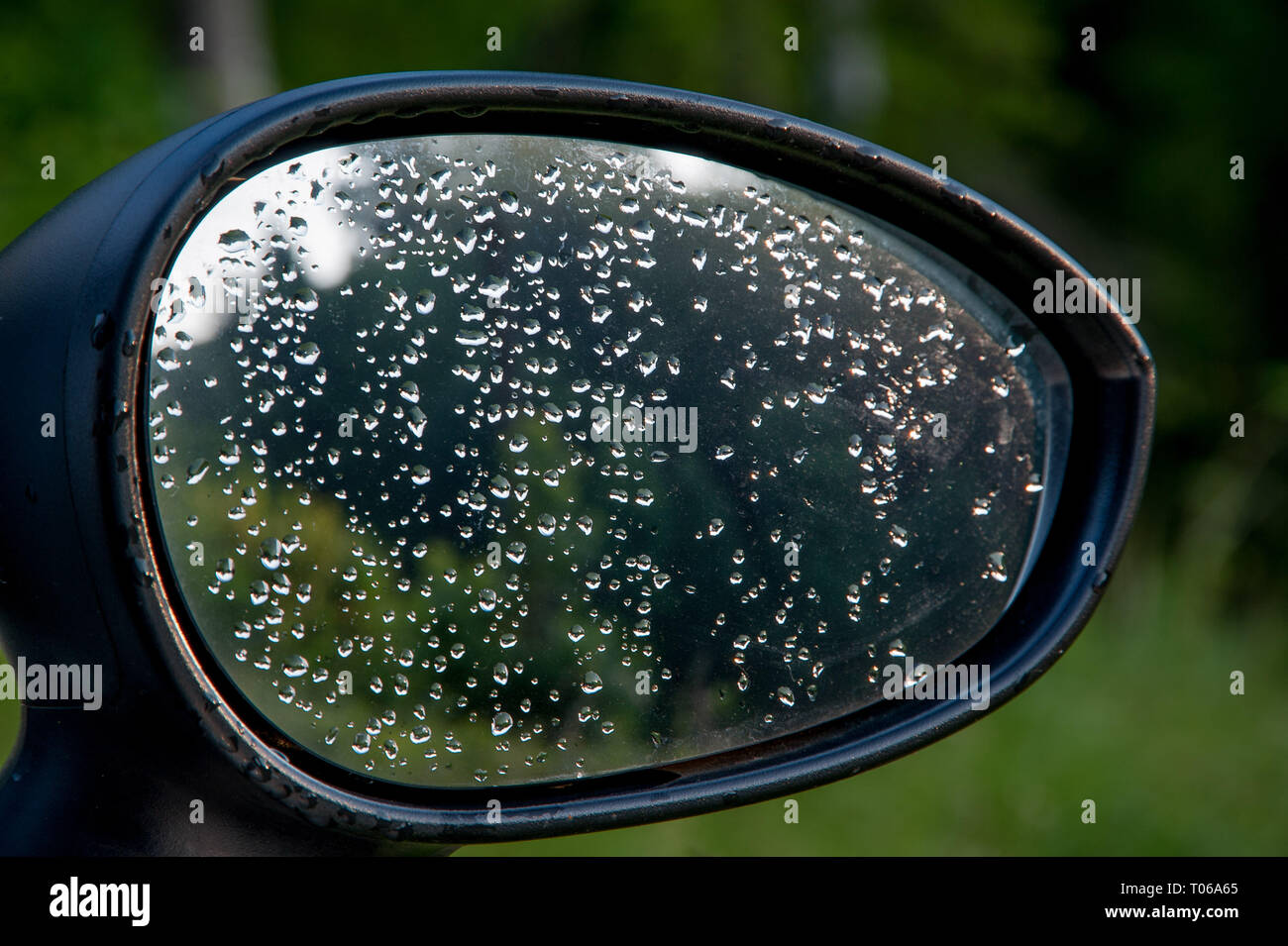 rearview mirror with rain drops after the storm Stock Photo - Alamy