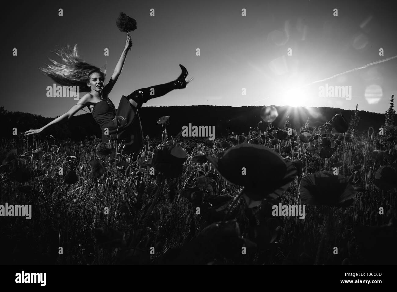 dancing girl in field of poppy seed Stock Photo - Alamy