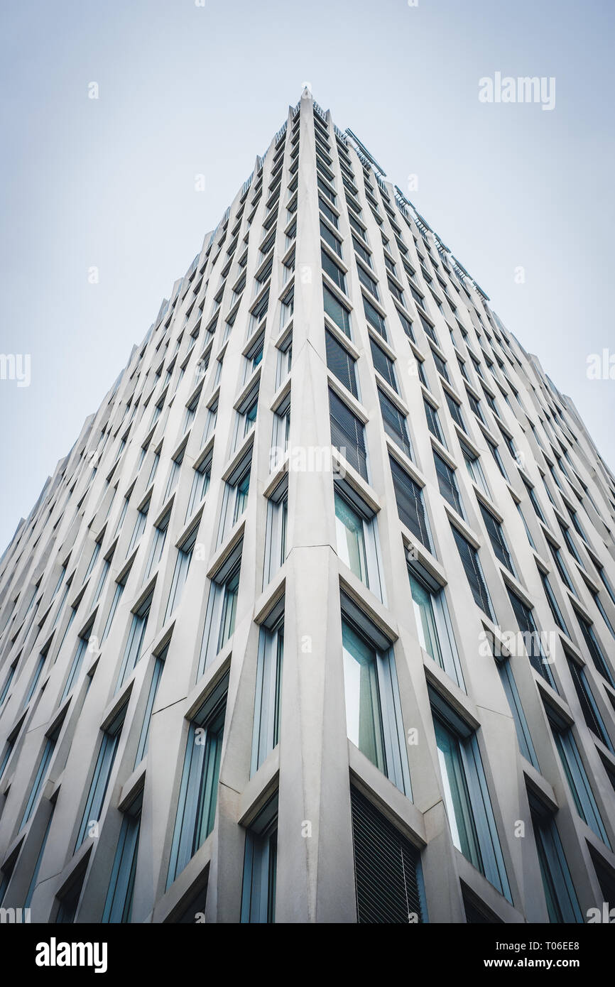 corner of modern skyscraper building, looking up on corporate building ...