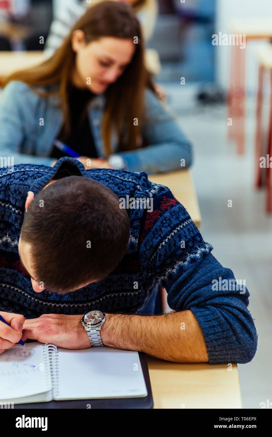 Happy friends doing homework together hi-res stock photography and ...