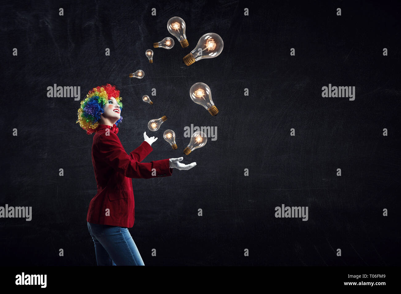 Juggling woman clown . Mixed media Stock Photo - Alamy