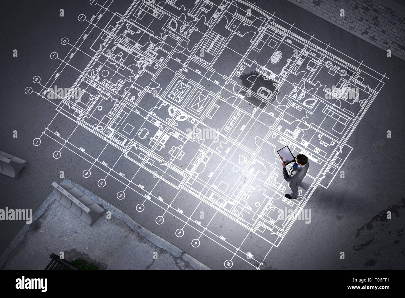 Man engineer thinking over his plan. Mixed media Stock Photo - Alamy