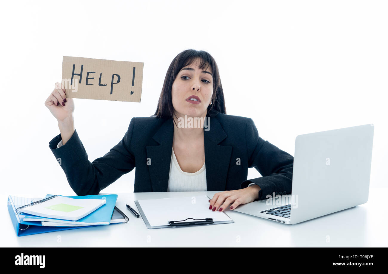 Young beautiful business woman suffering stress working at desk holding ...