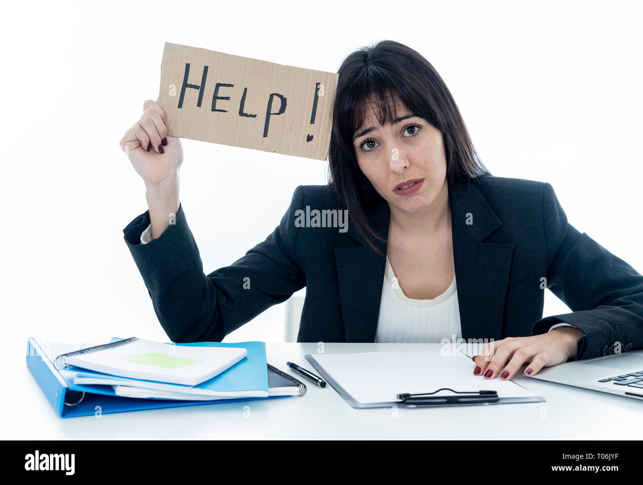 Young beautiful business woman suffering stress working at desk holding ...